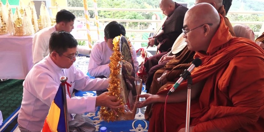 Religious Ceremony: Golden umbrella, vane and diamond bud hoisted atop ...