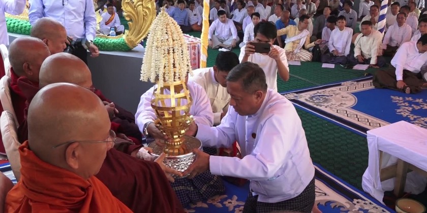 Religious Ceremony: Golden umbrella, vane and diamond bud hoisted atop ...