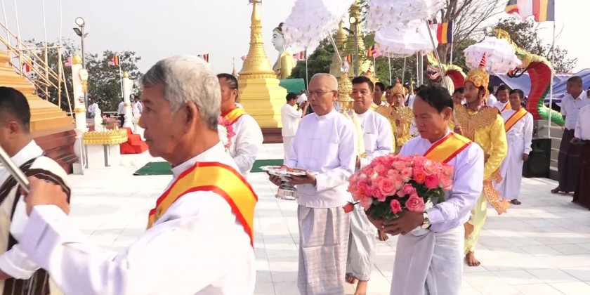 Religious Ceremony: Golden umbrella, vane and diamond bud hoisted atop ...