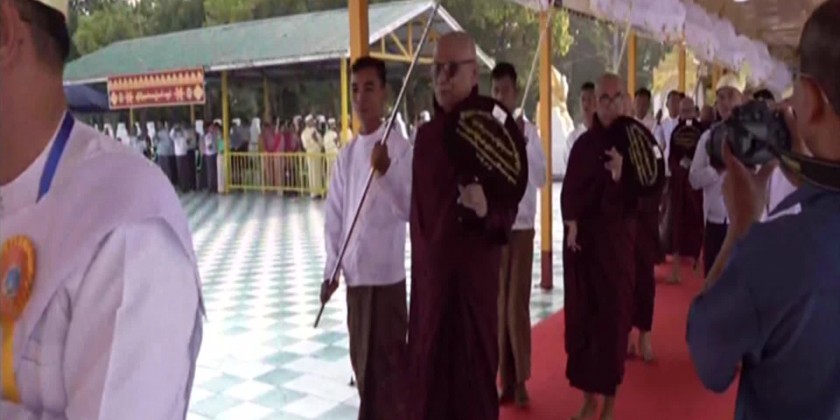 Religious ceremony: Diamond orb and pennant-shaped vane hoisted ...