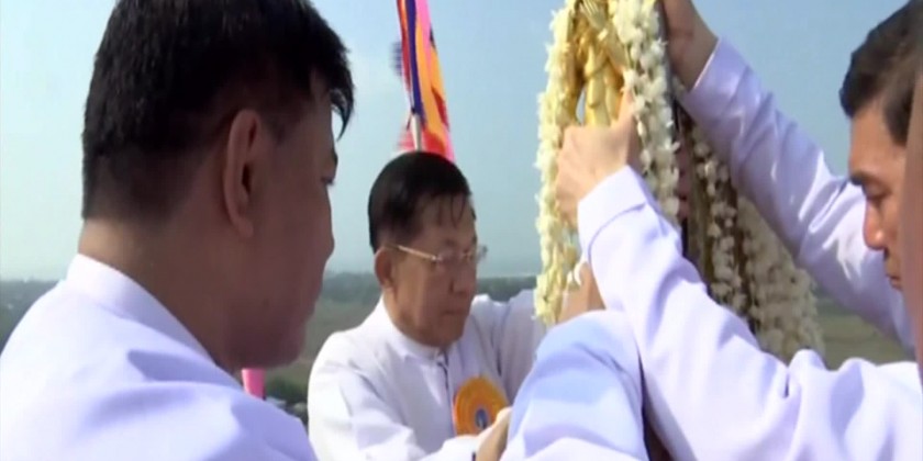 Religious ceremony: Diamond orb and pennant-shaped vane hoisted ...