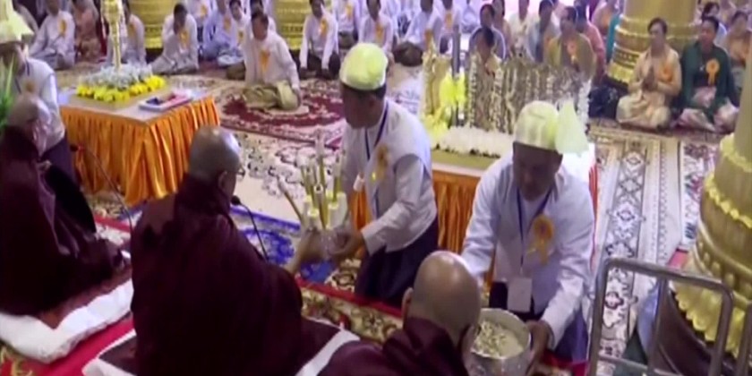 Religious ceremony: Diamond orb and pennant-shaped vane hoisted ...