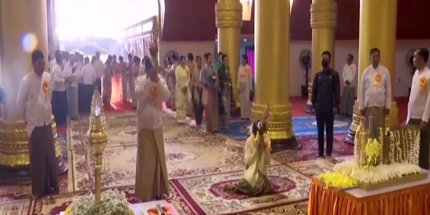 Religious ceremony: Diamond orb and pennant-shaped vane hoisted ...